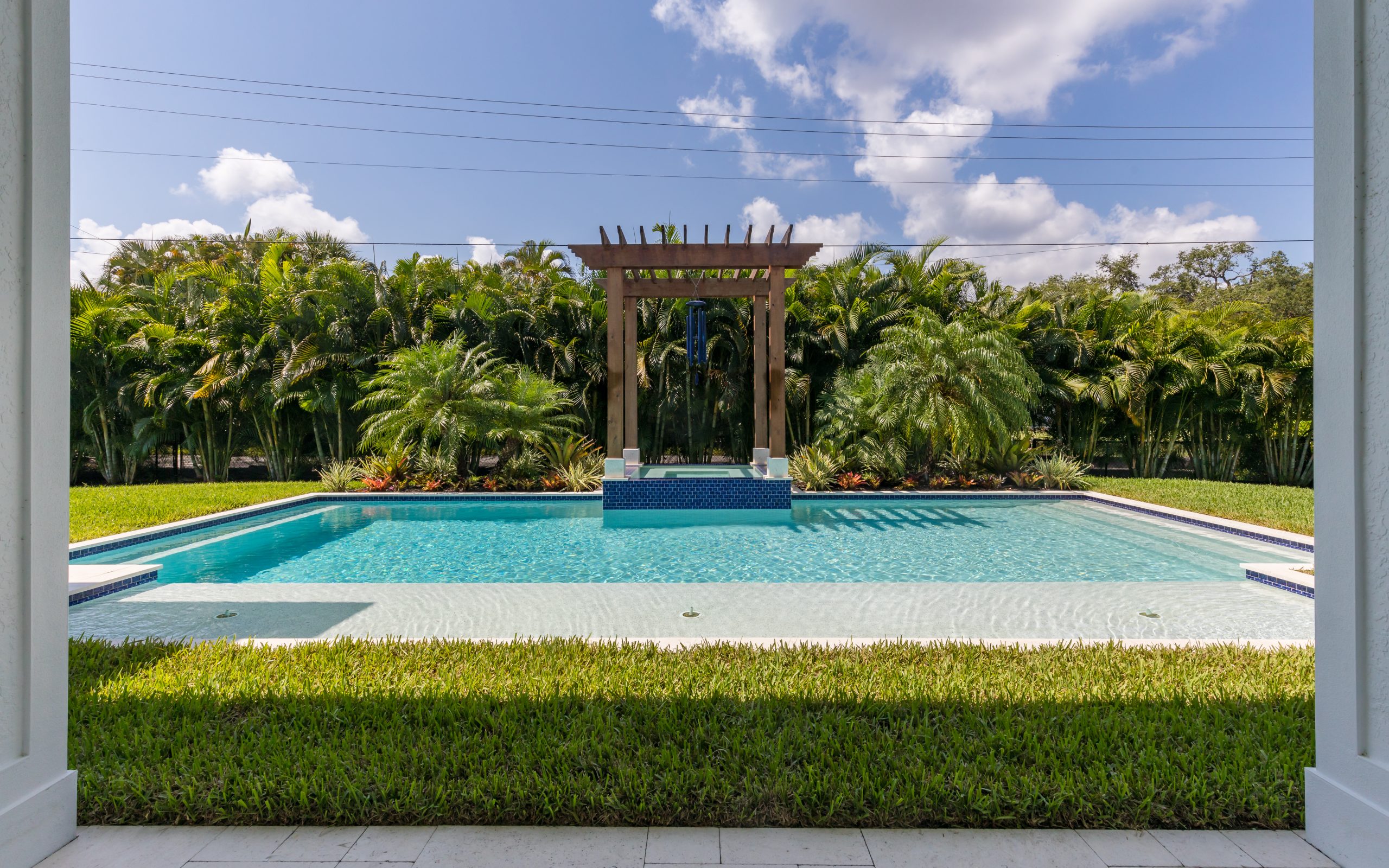 The Allure of a Grass Pool Deck - Aubuchon Homes